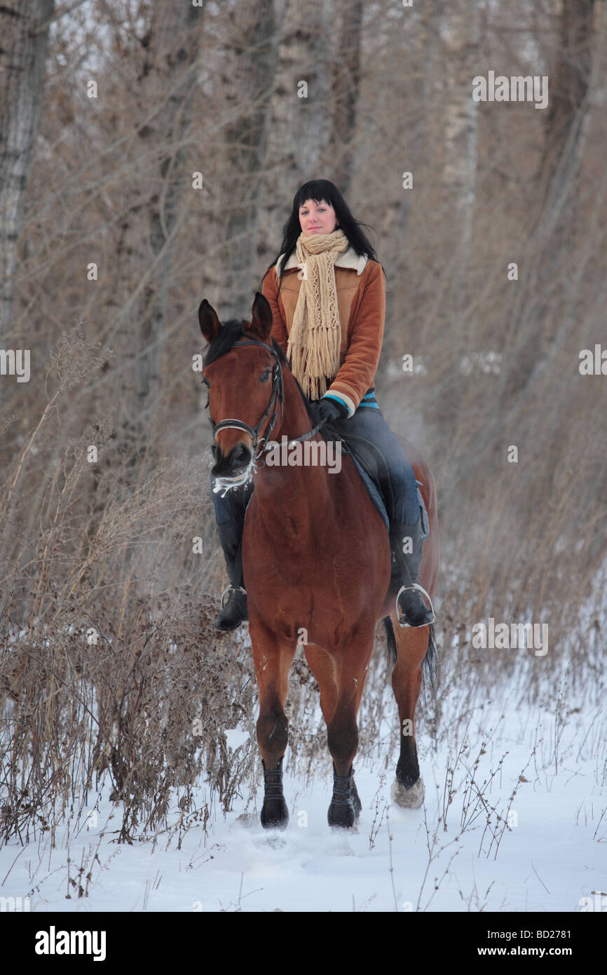 Woman horseback riding on the park way Stock Photo - Alamy