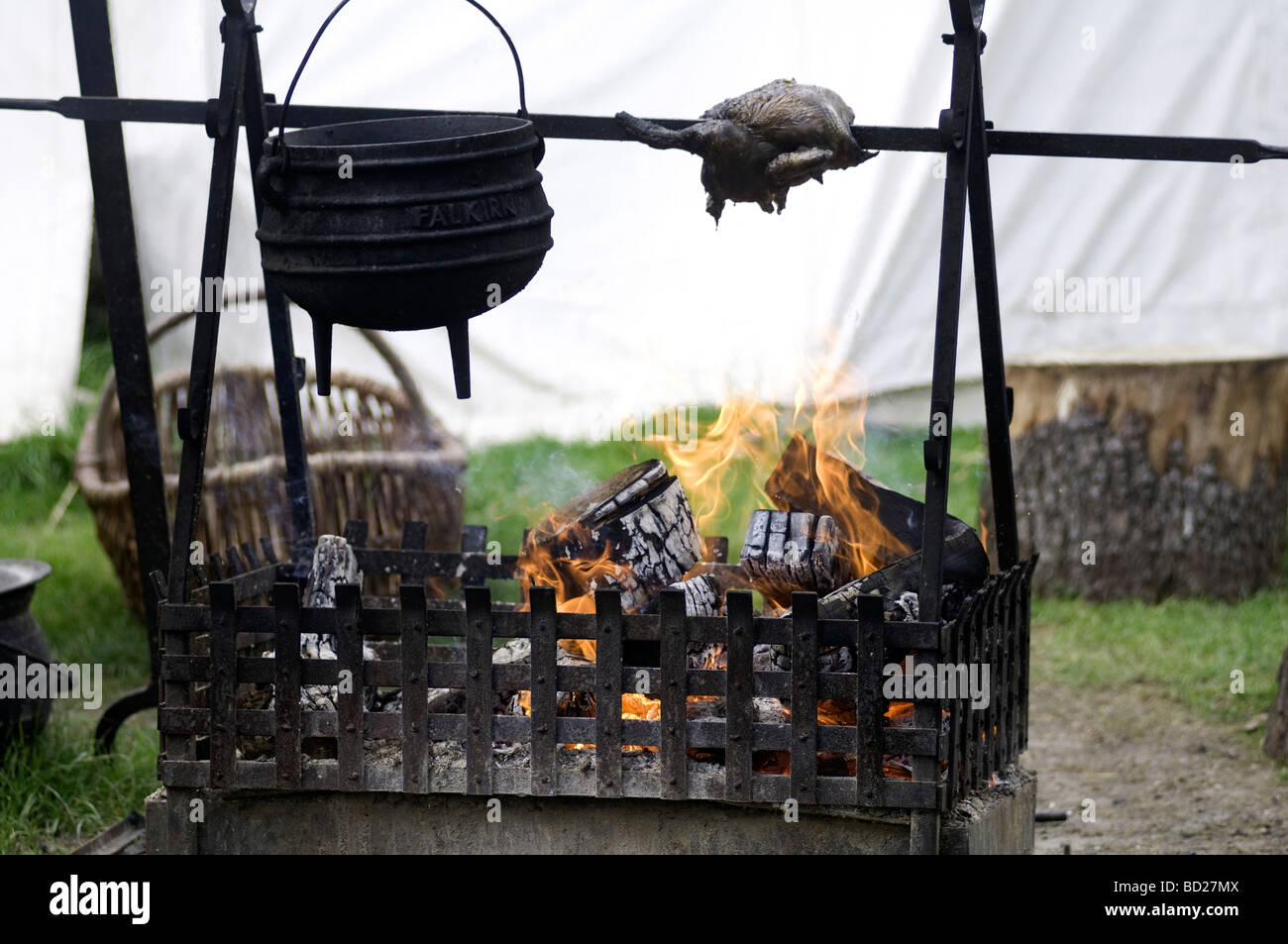 Black Cooking pot shown during medieval feasting Stock Photo - Alamy