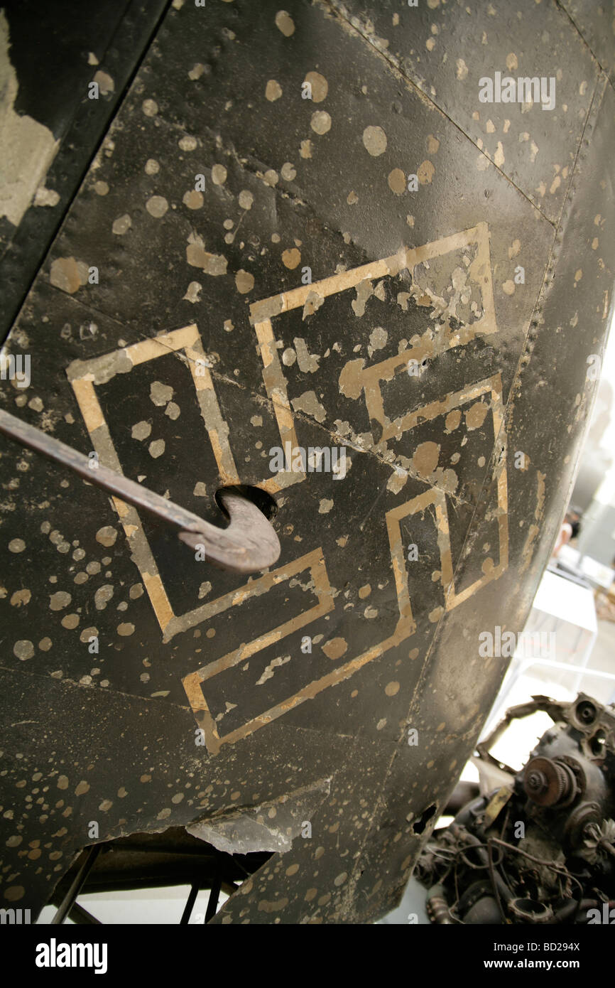 German shot up tail plane with a swastika in portrait Stock Photo - Alamy