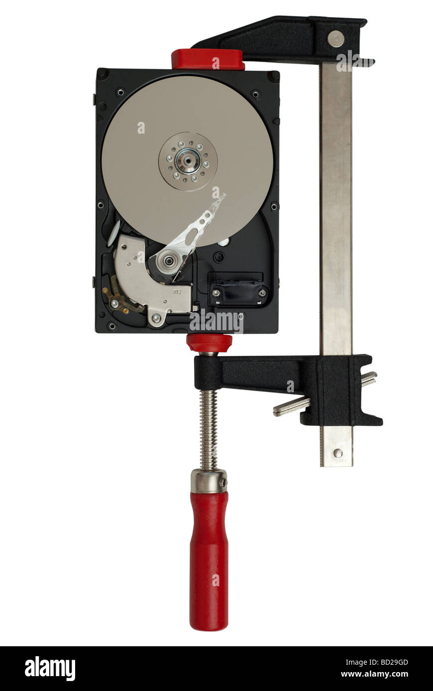 Open hard disk drive in a clamp or vise to visualize the concept of ...