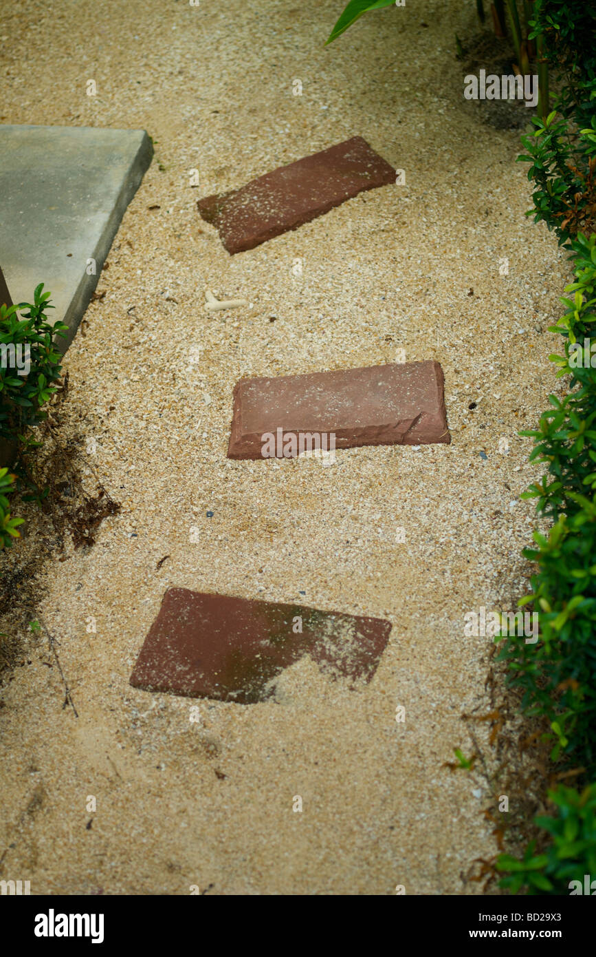 Stone path in sand leading to a beach bungalow in had yao Koh Phangan ...