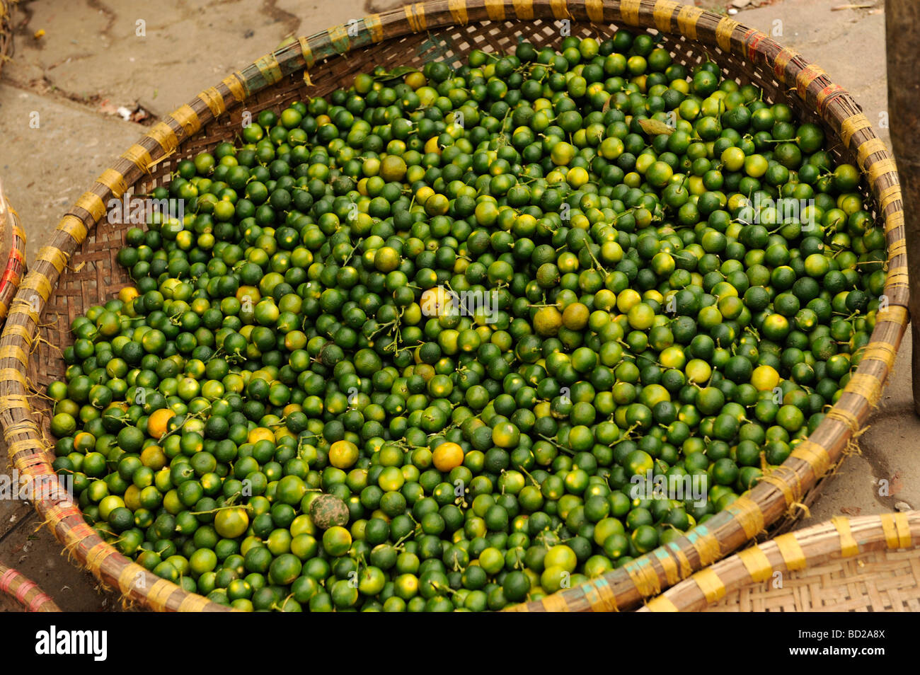 small limes in bamboo basket selling in the market, Old Quarter, Hanoi ...