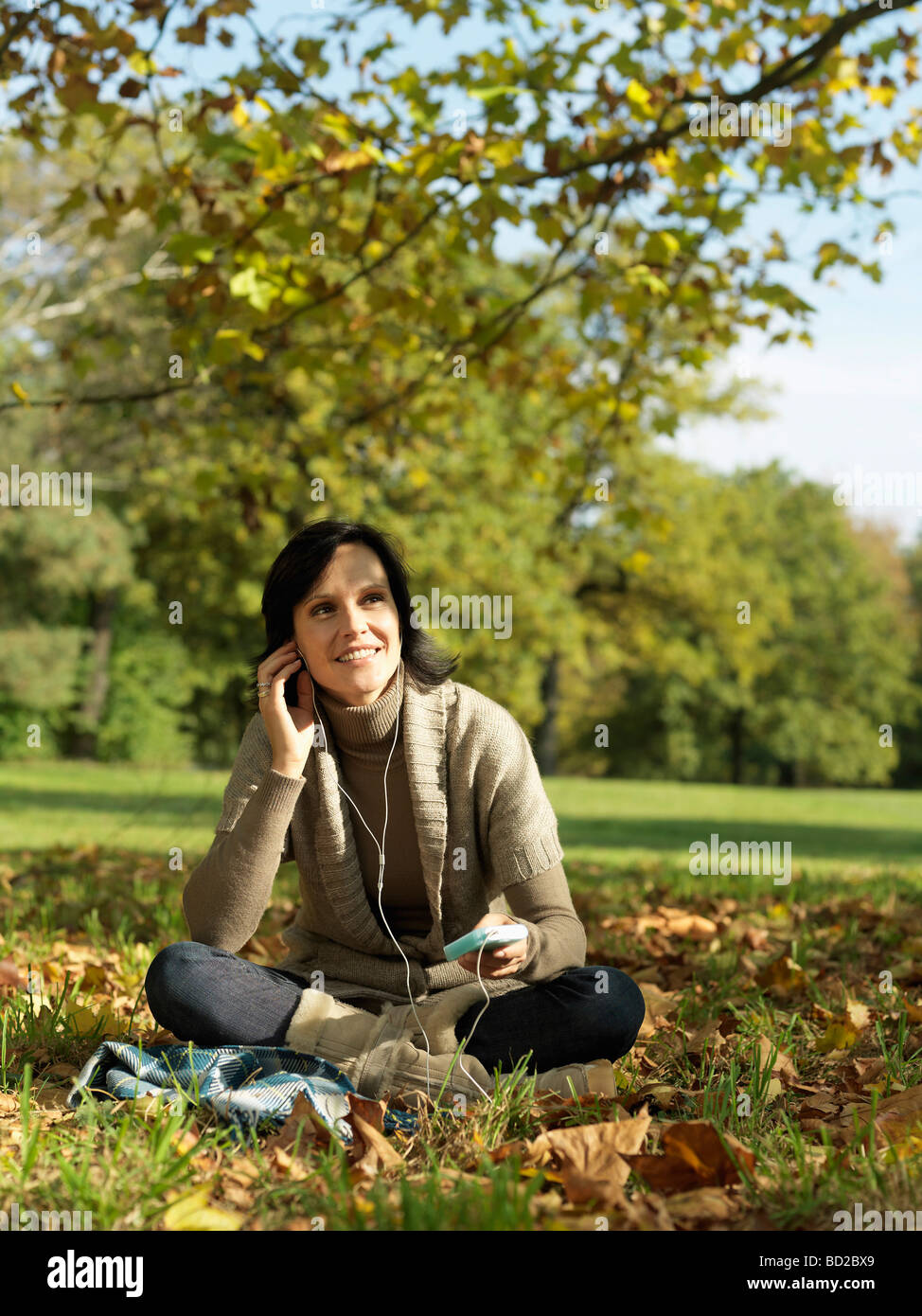 Woman under tree hi-res stock photography and images - Alamy