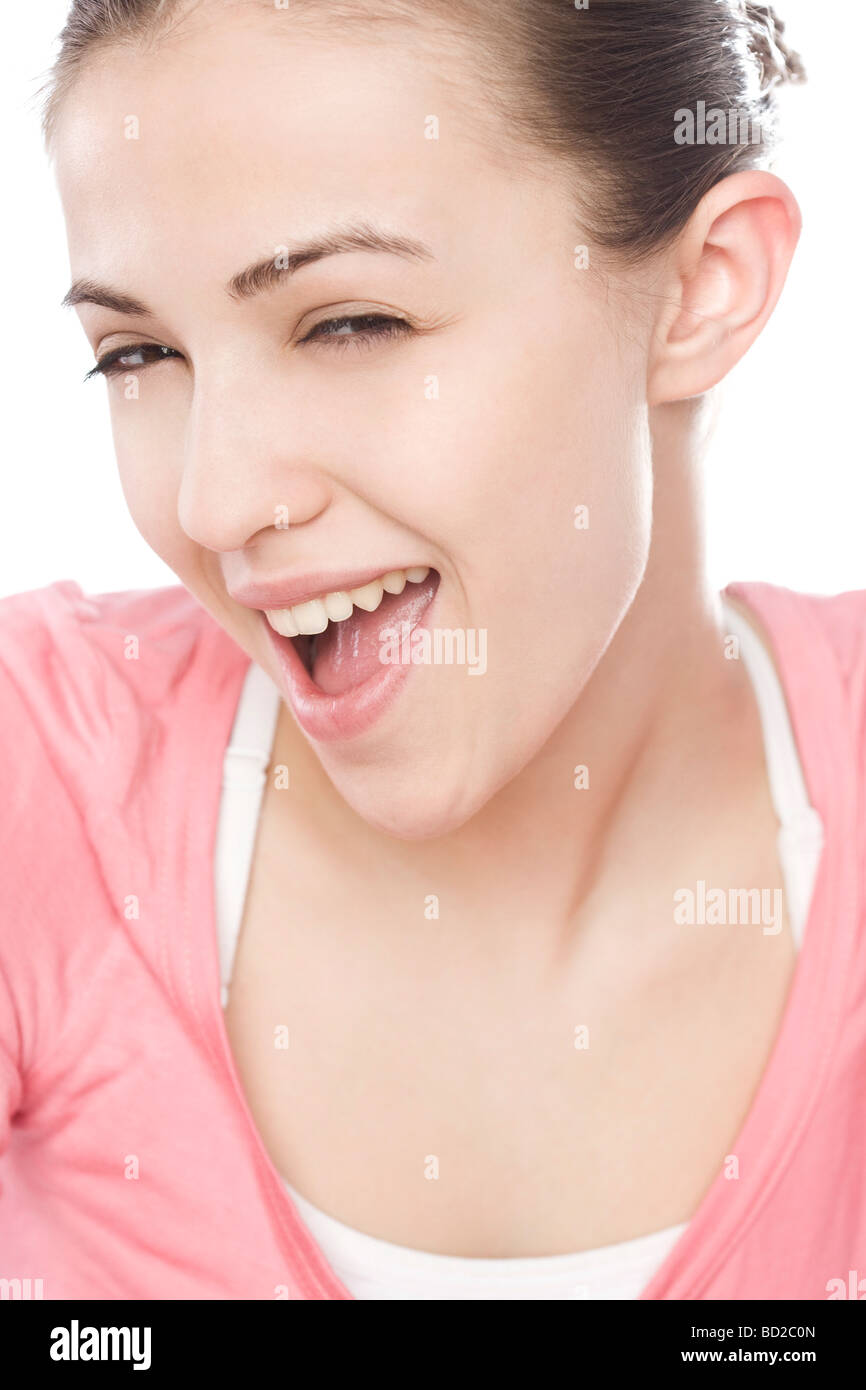 Young woman blinking and smiling Stock Photo - Alamy