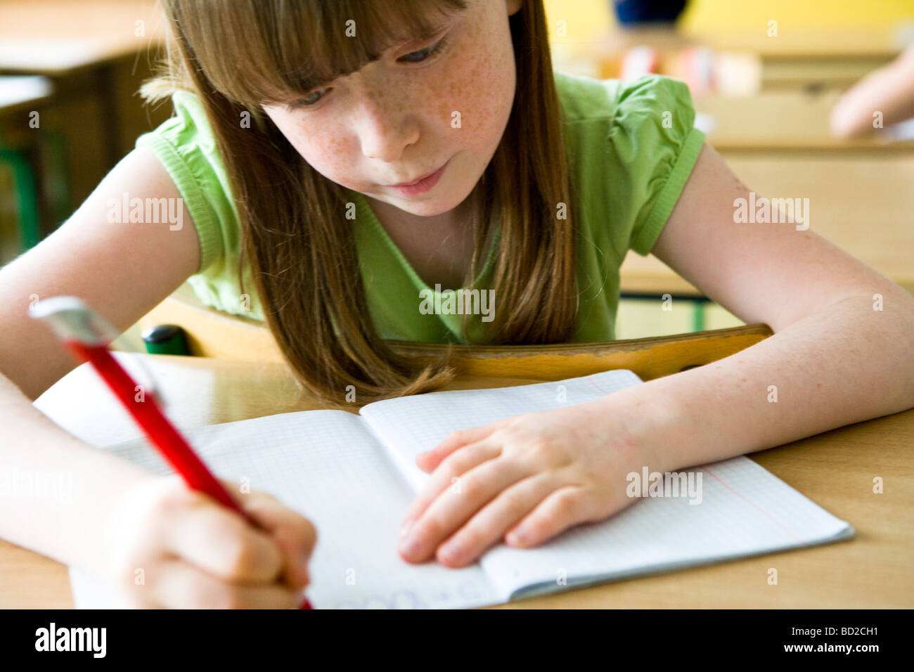 Girl studying at school Stock Photo - Alamy