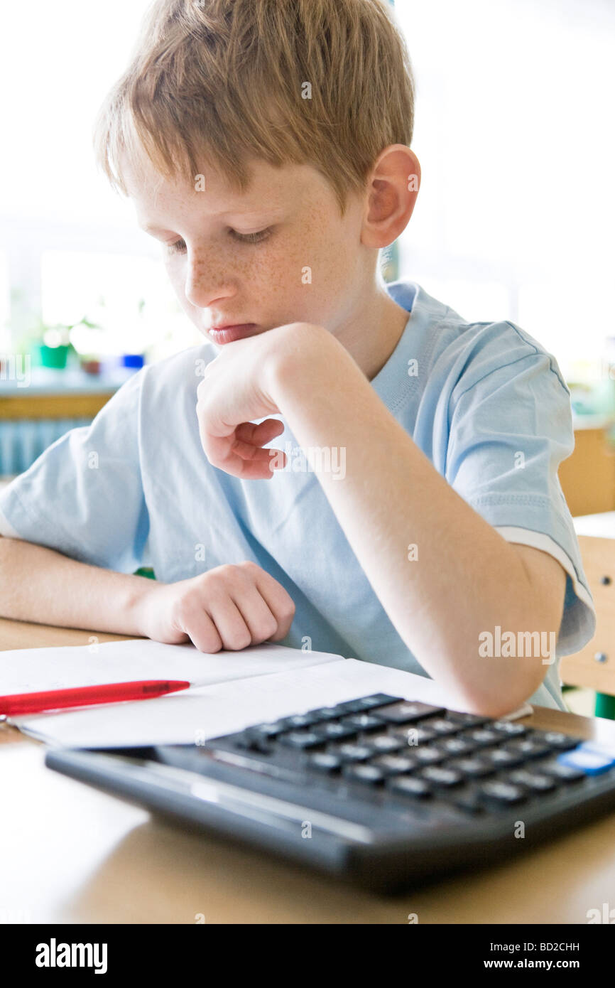 Boy studying in school Stock Photo - Alamy