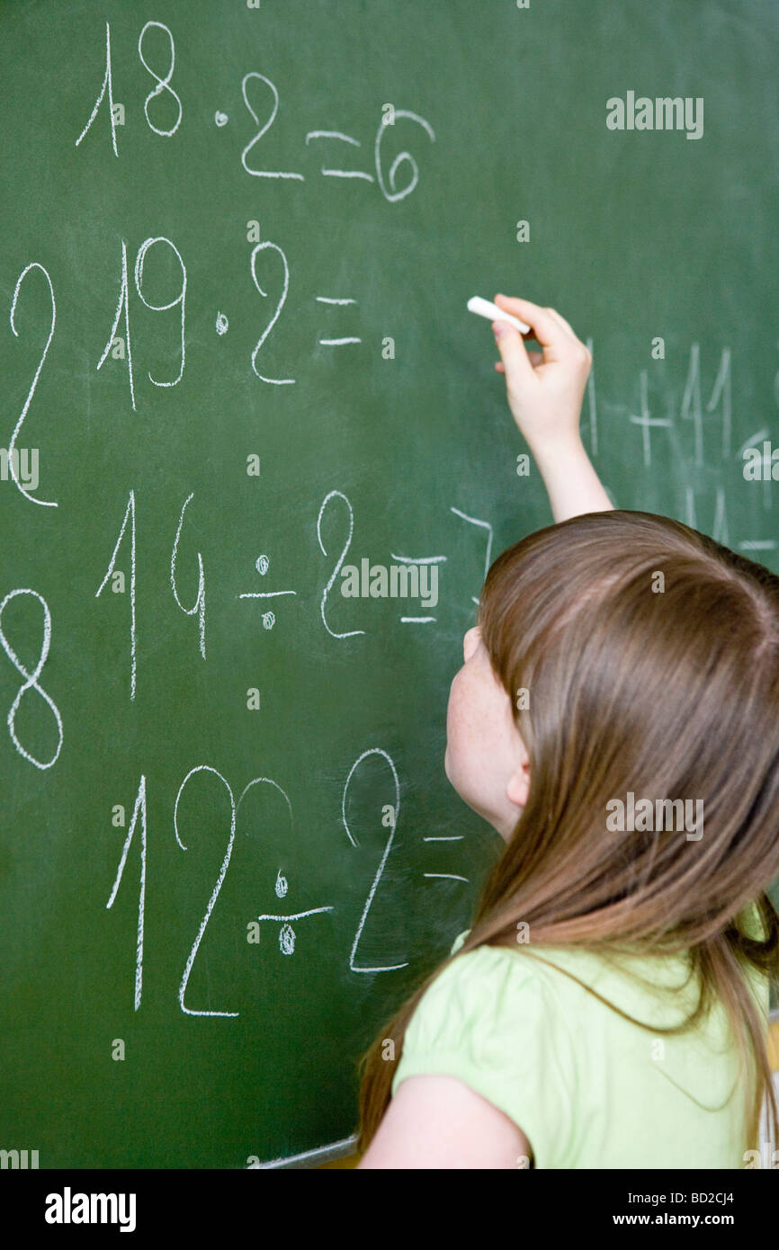 girl writing on blackboard Stock Photo - Alamy