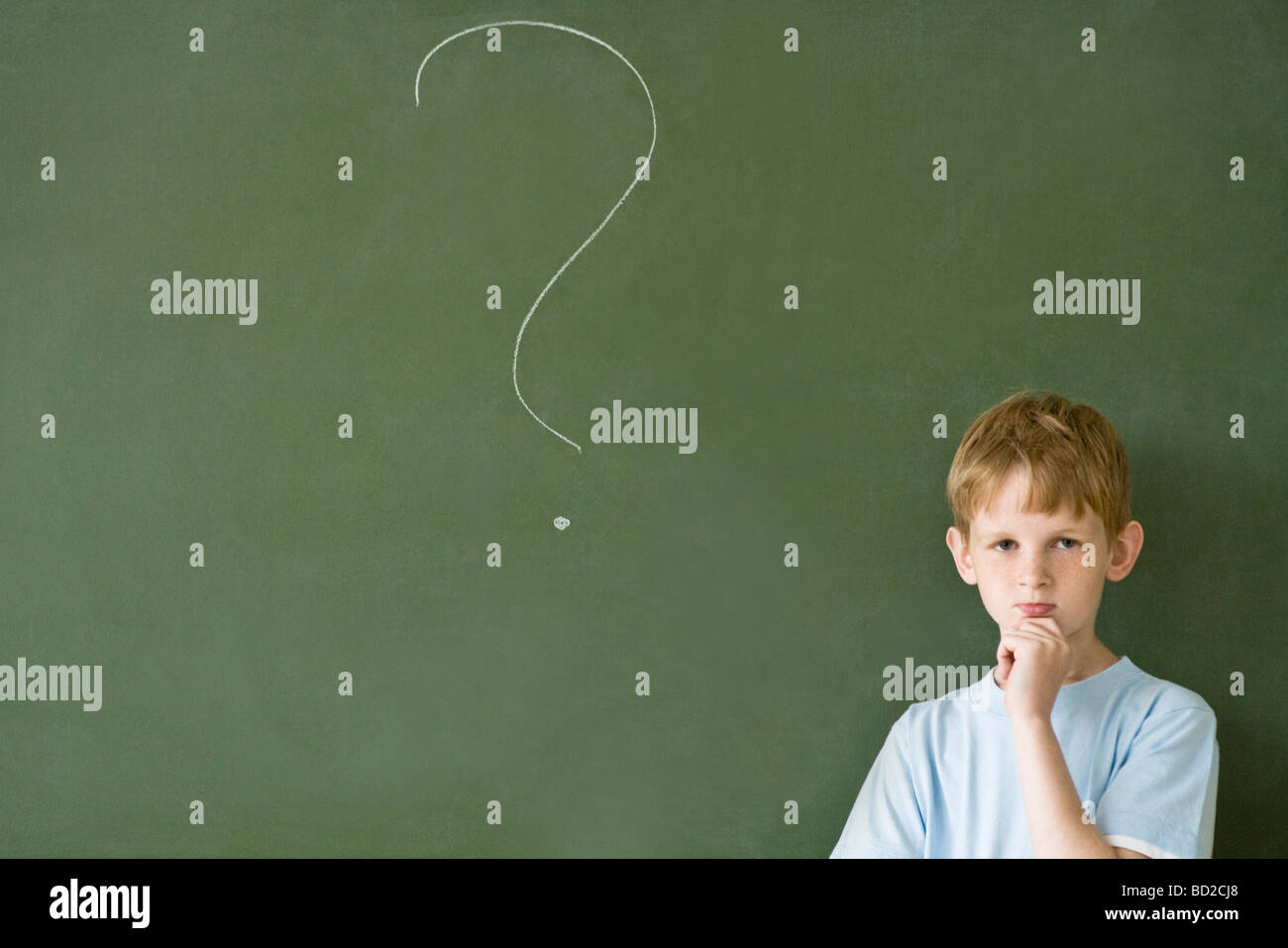 boy looking for answer at school Stock Photo - Alamy