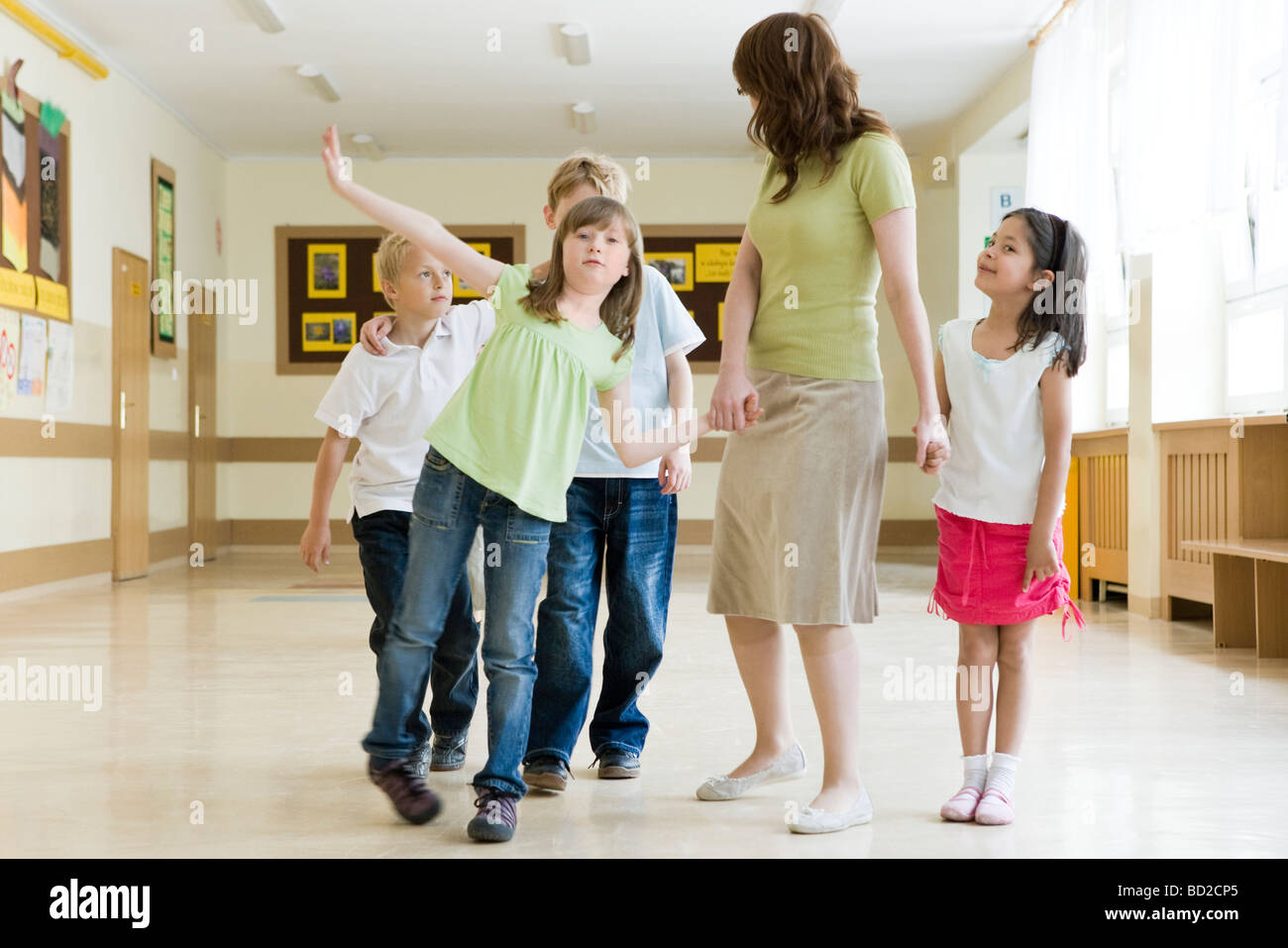 Children teacher in school corridor hi-res stock photography and images - Alamy