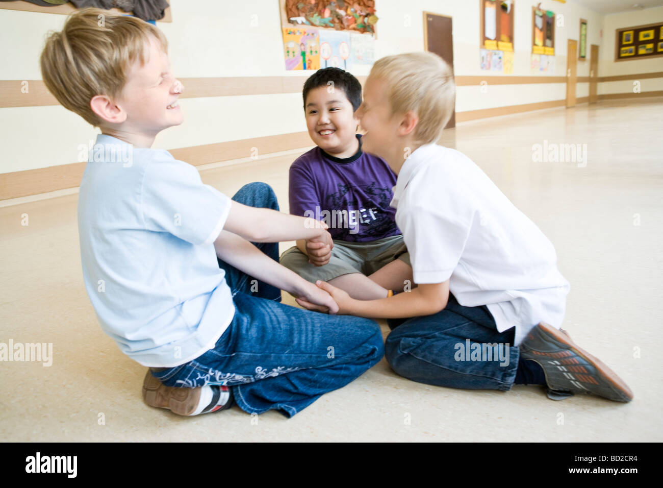 boys playing in school corridor Stock Photo - Alamy