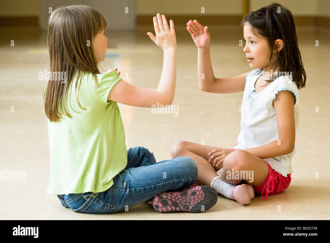 girls playing in school corridor Stock Photo - Alamy