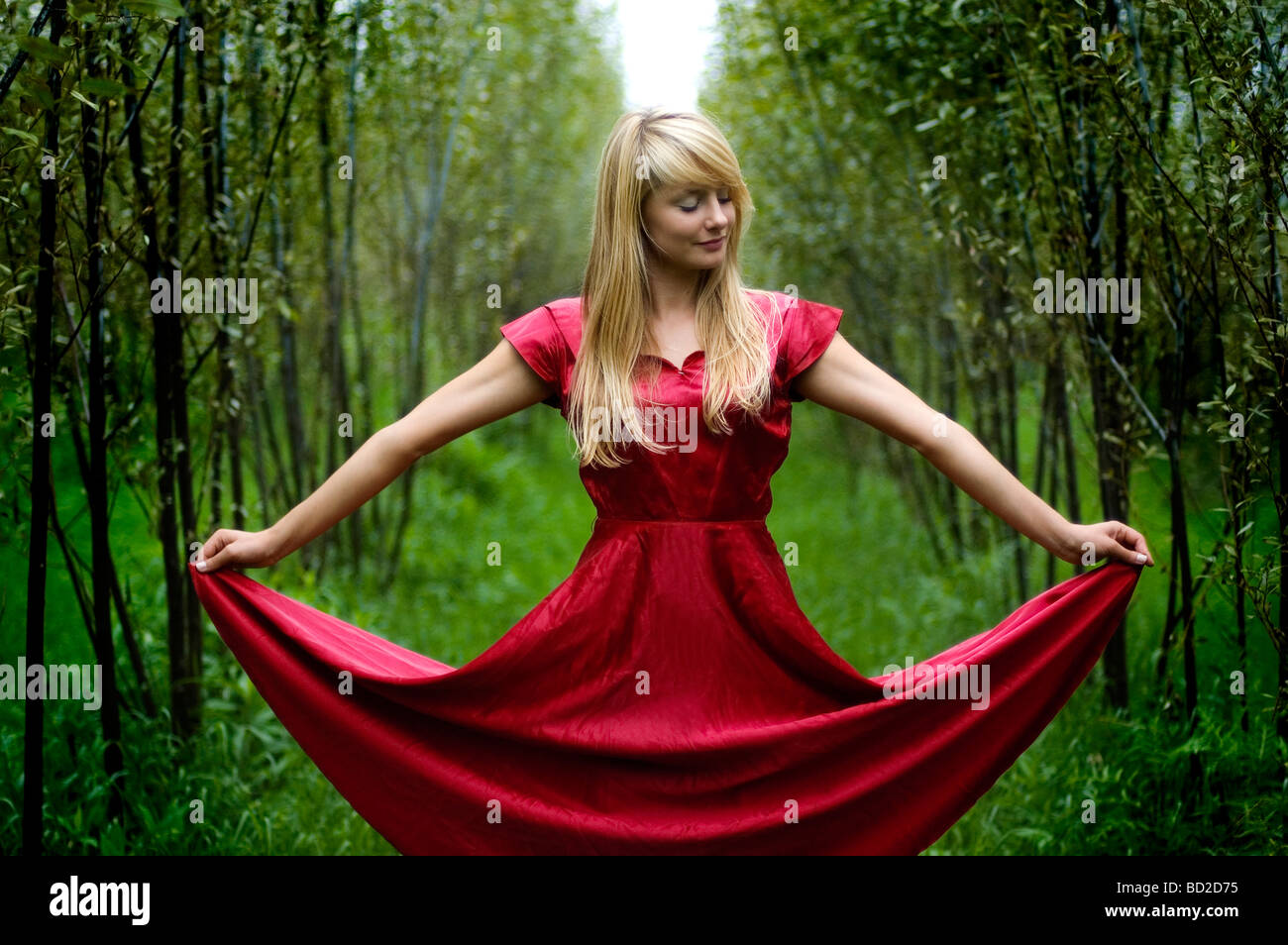 Young woman dancing in forest Stock Photo - Alamy