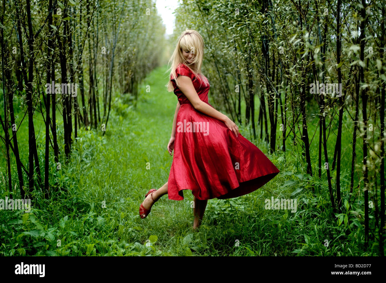 Young woman dancing in forest Stock Photo - Alamy