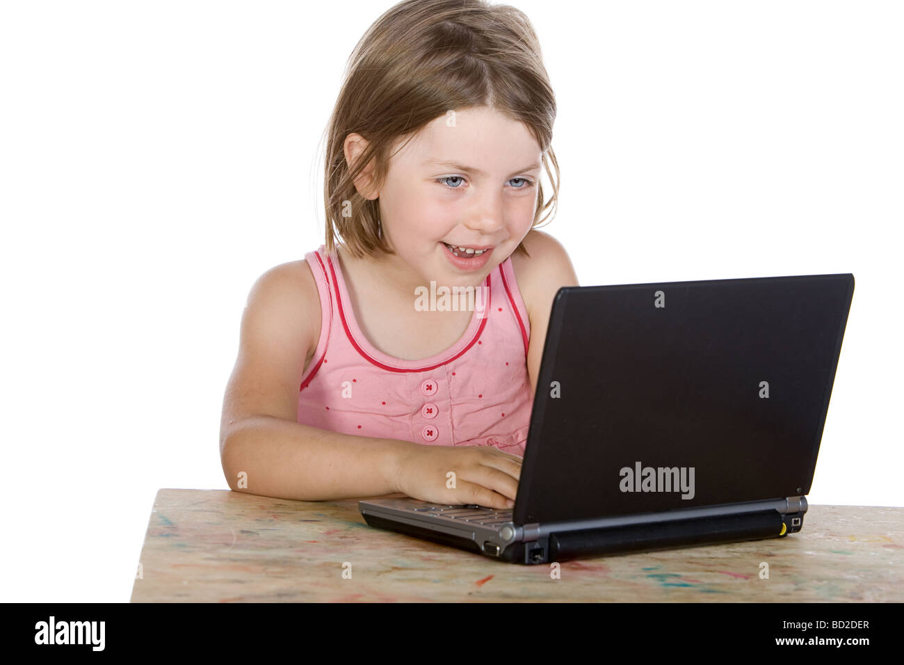 Shot of a Happy Child Using her Laptop Stock Photo - Alamy