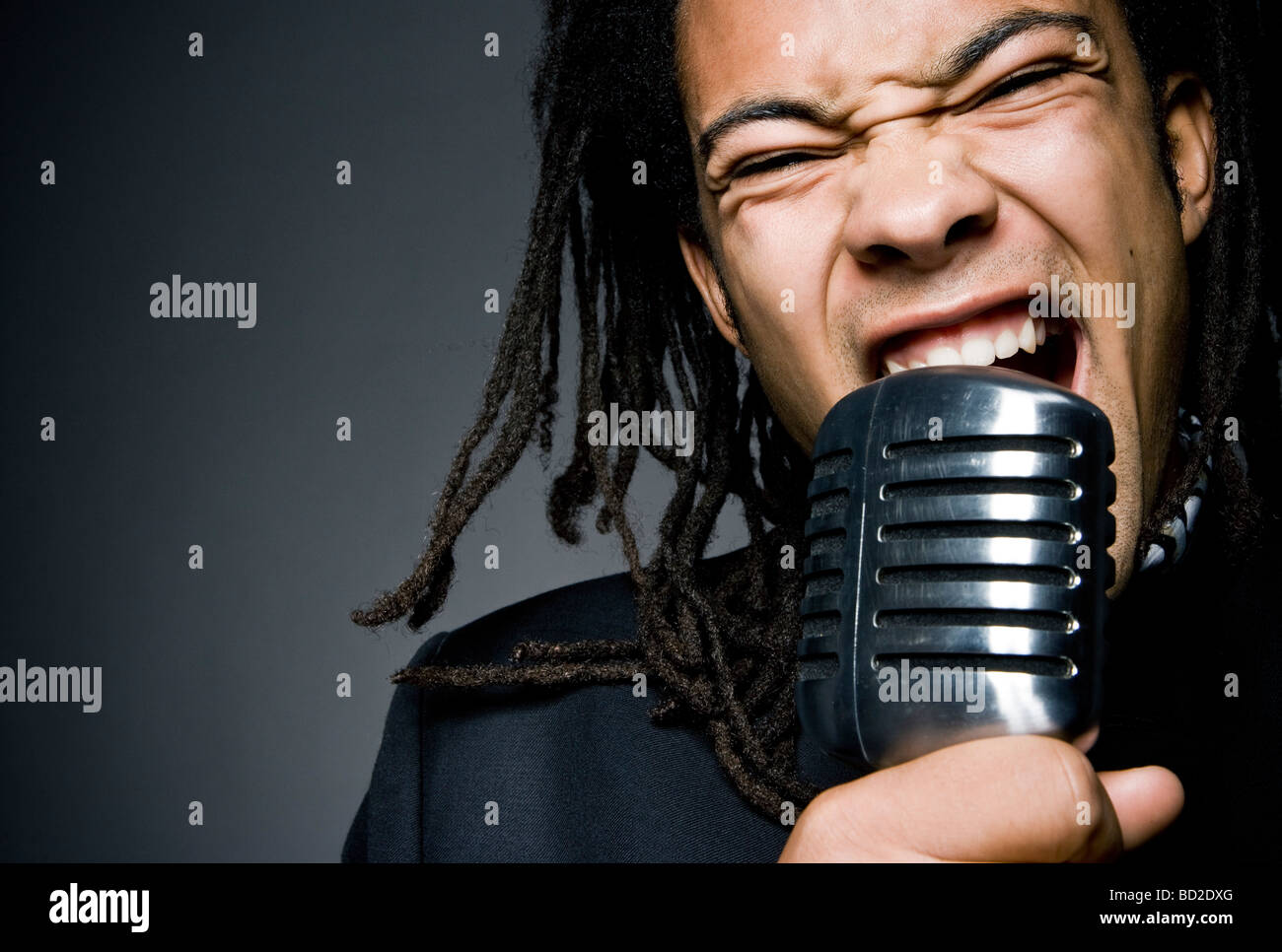 man shouting into mic close-up Stock Photo - Alamy