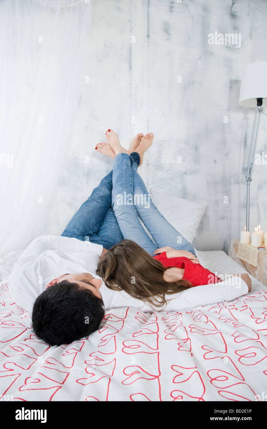couple cuddling in bed Stock Photo - Alamy