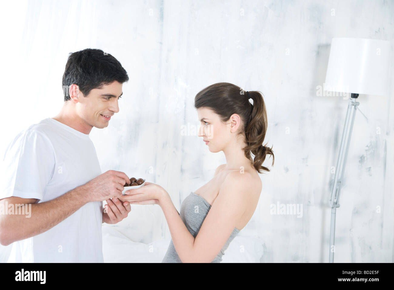 couple eating chocolates Stock Photo - Alamy