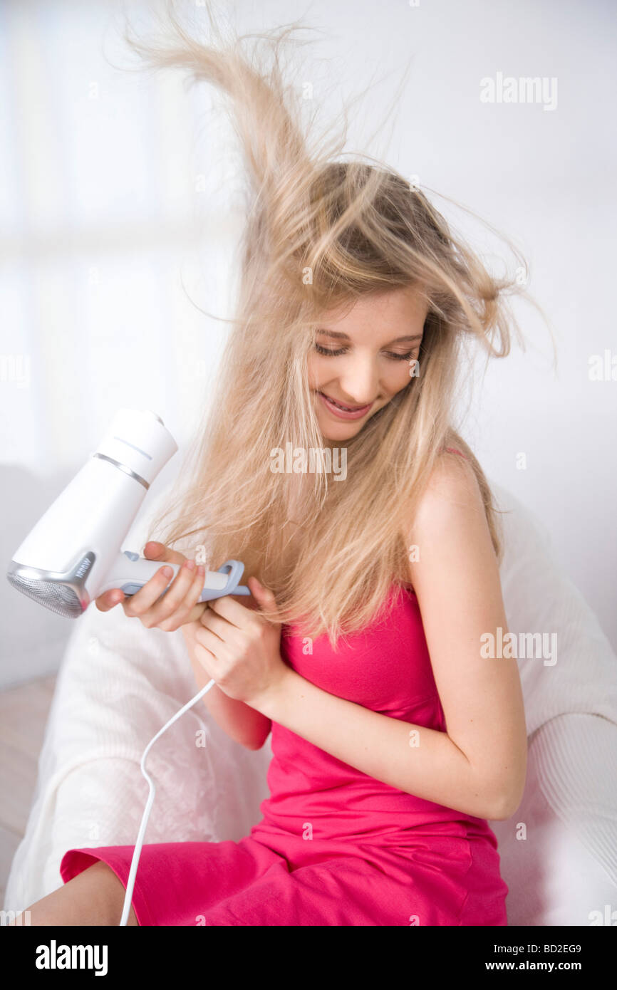 young woman drying hair Stock Photo - Alamy