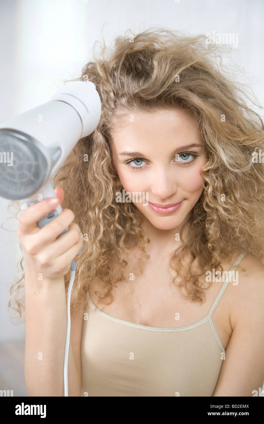 young woman drying hair Stock Photo - Alamy