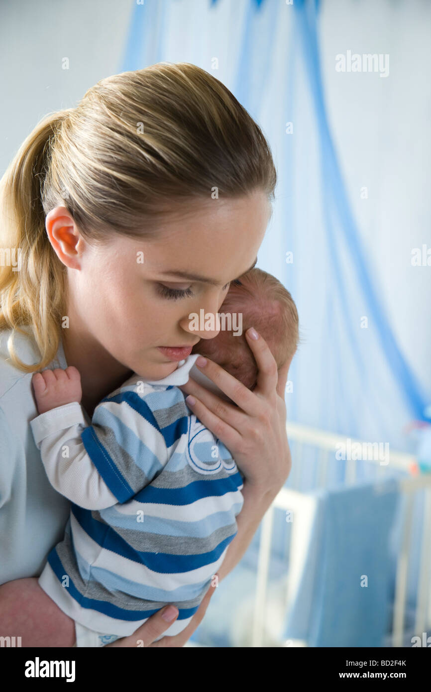 Months carrying hug hugging infant hi-res stock photography and images ...
