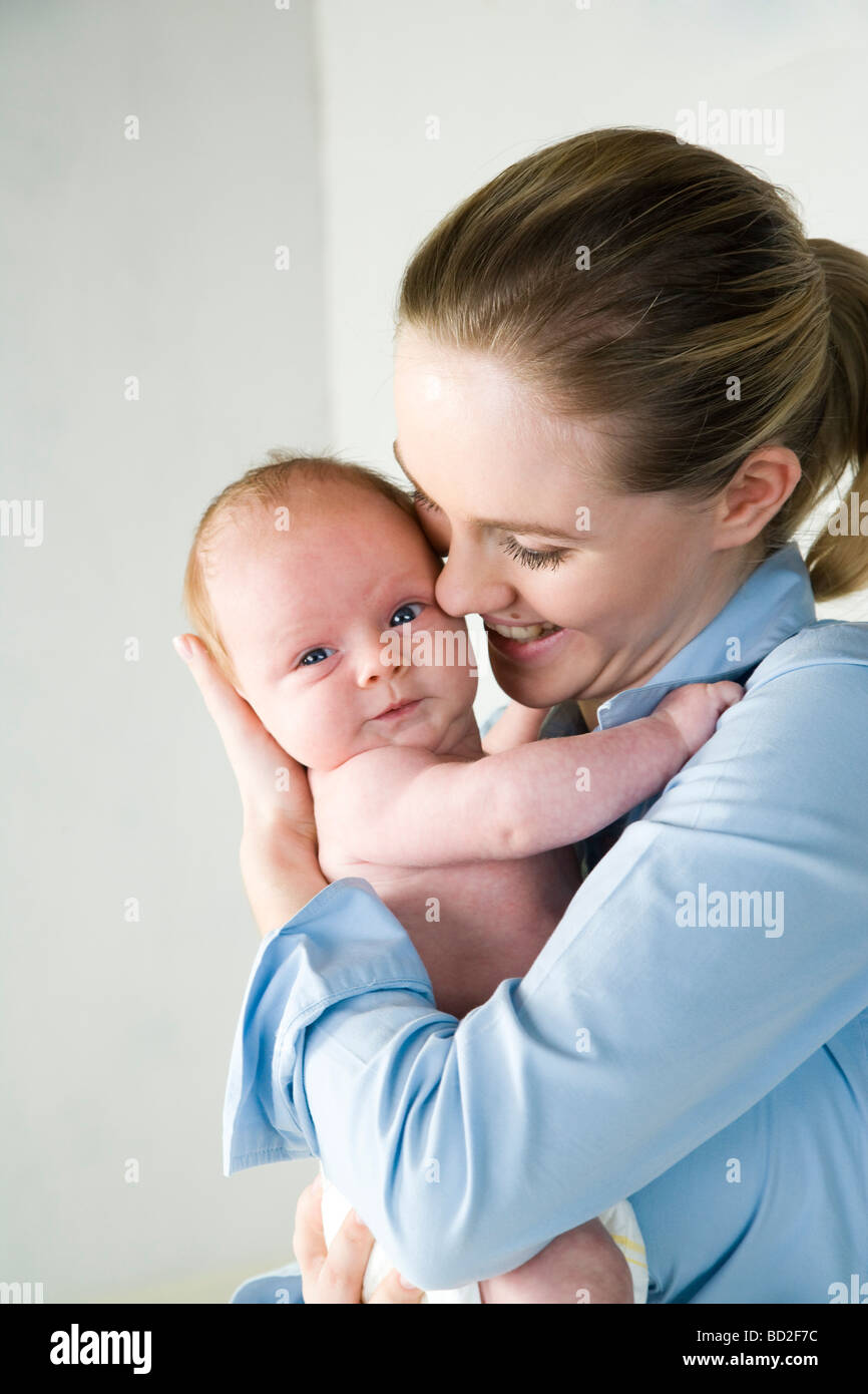 Months carrying hug hugging infant hi-res stock photography and images ...