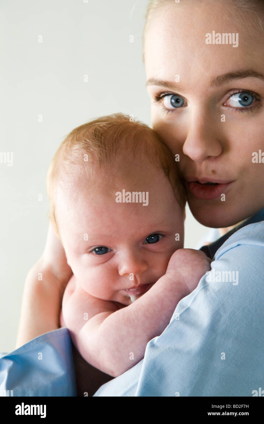 Months carrying hug hugging infant hi-res stock photography and images ...