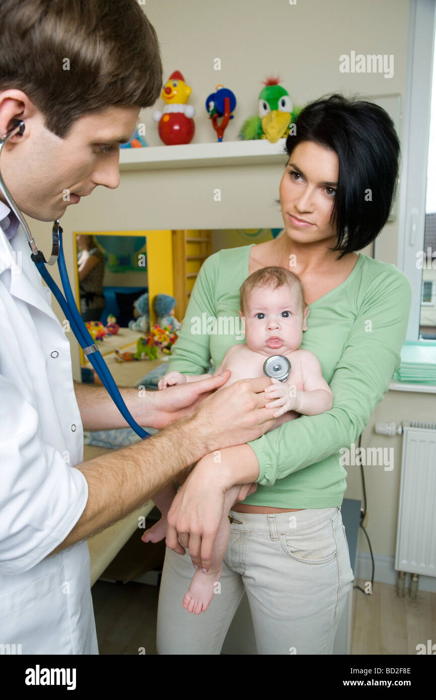 doctor examining infant Stock Photo - Alamy