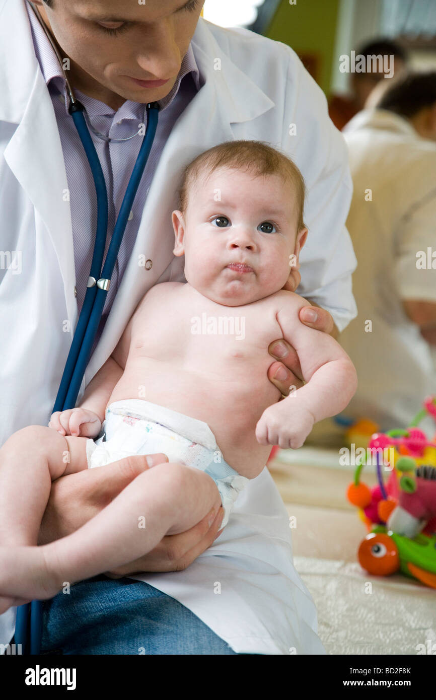 doctor examining infant Stock Photo - Alamy