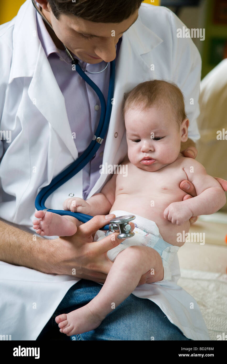 doctor examining infant Stock Photo - Alamy