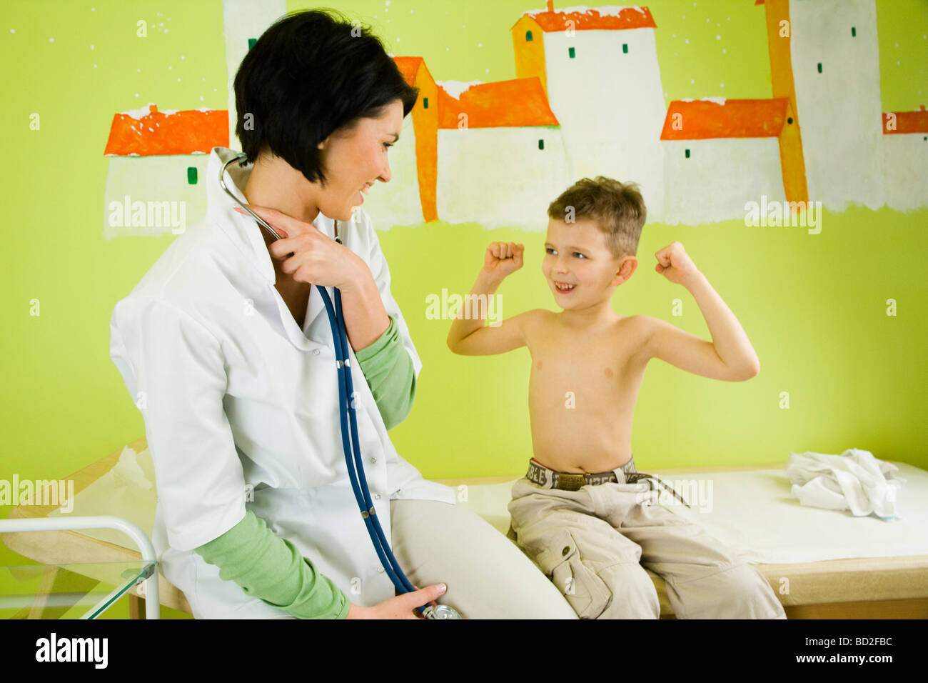doctor talking with small patient Stock Photo - Alamy