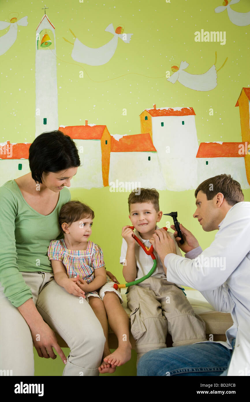 mother with children visiting doctor Stock Photo - Alamy