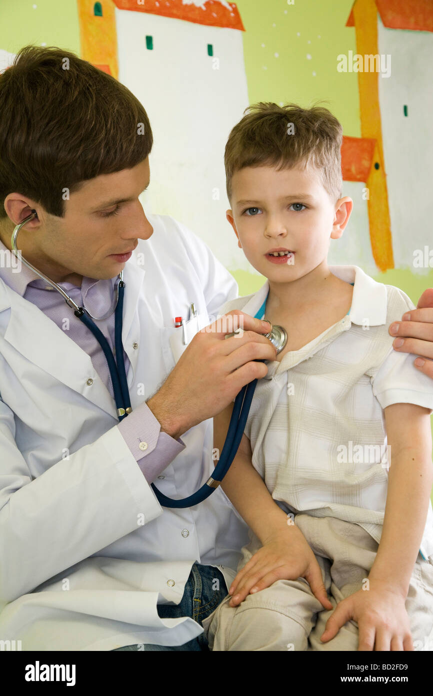 doctor examining a boy Stock Photo - Alamy