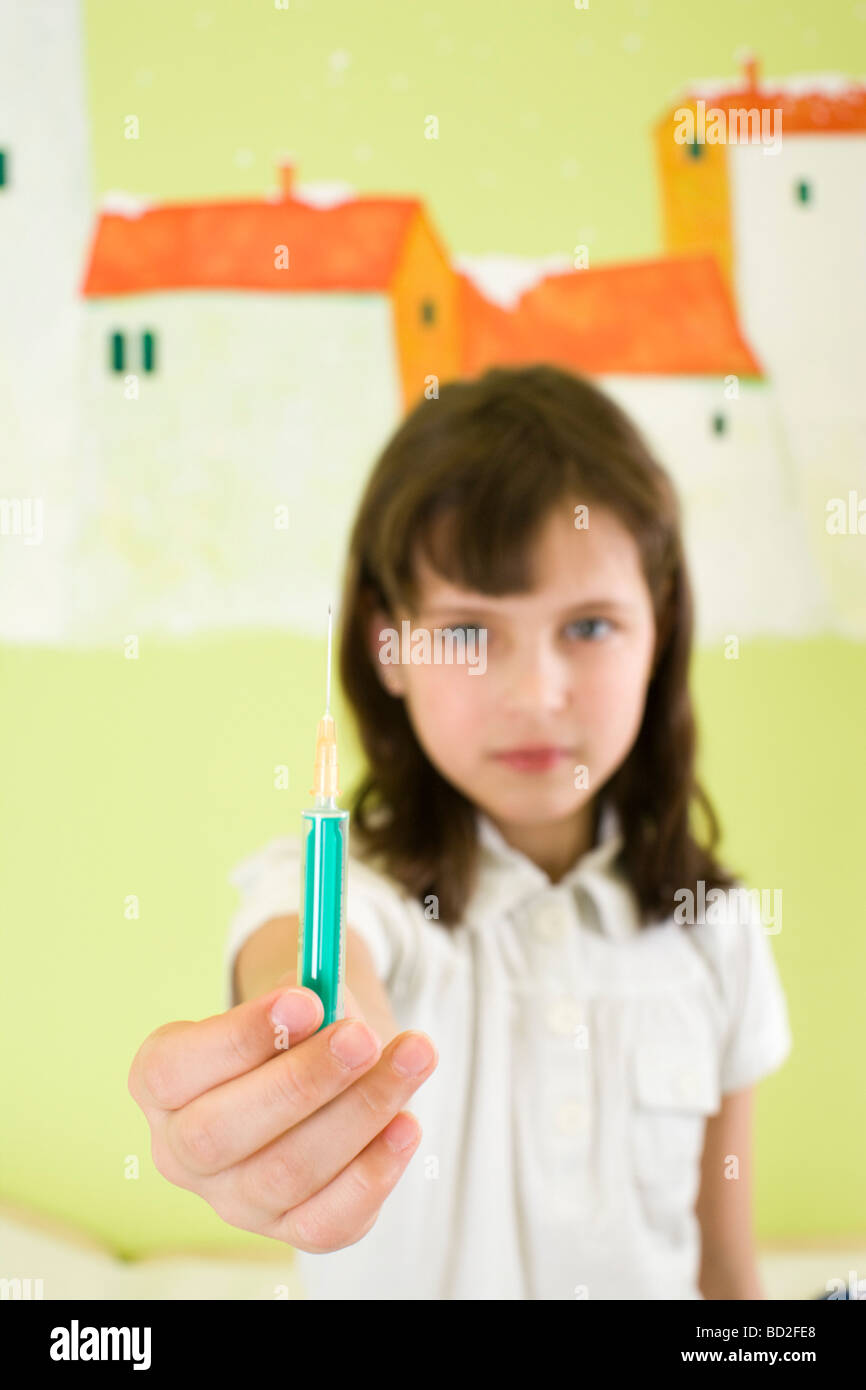 girl holding syringe Stock Photo - Alamy