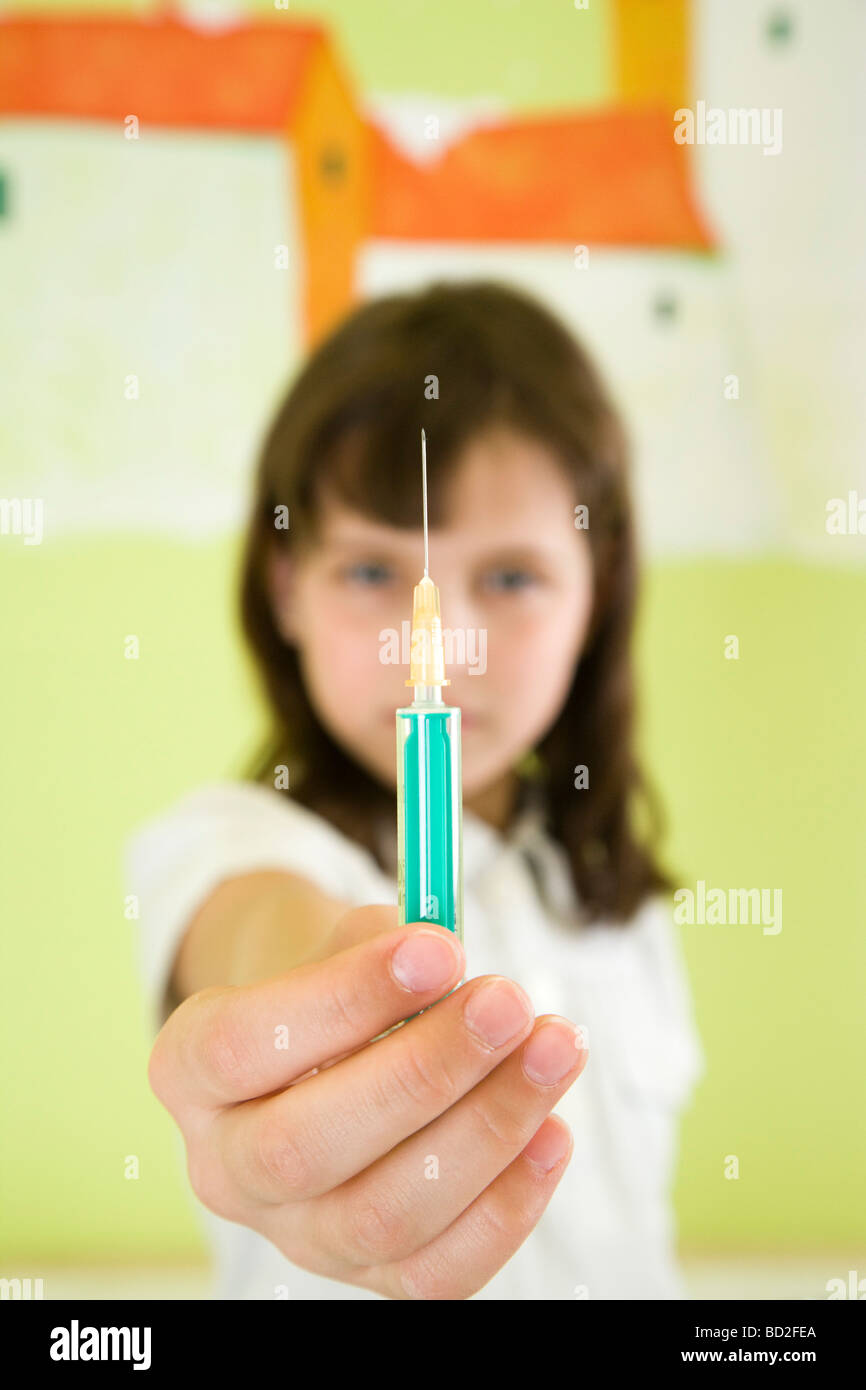 girl holding syringe Stock Photo - Alamy