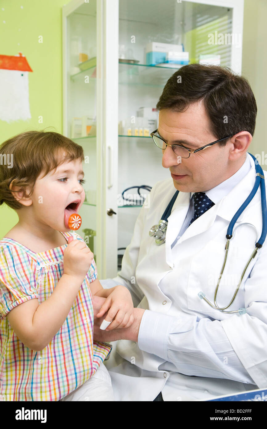 Doctor giving patient lollipop hi-res stock photography and images - Alamy