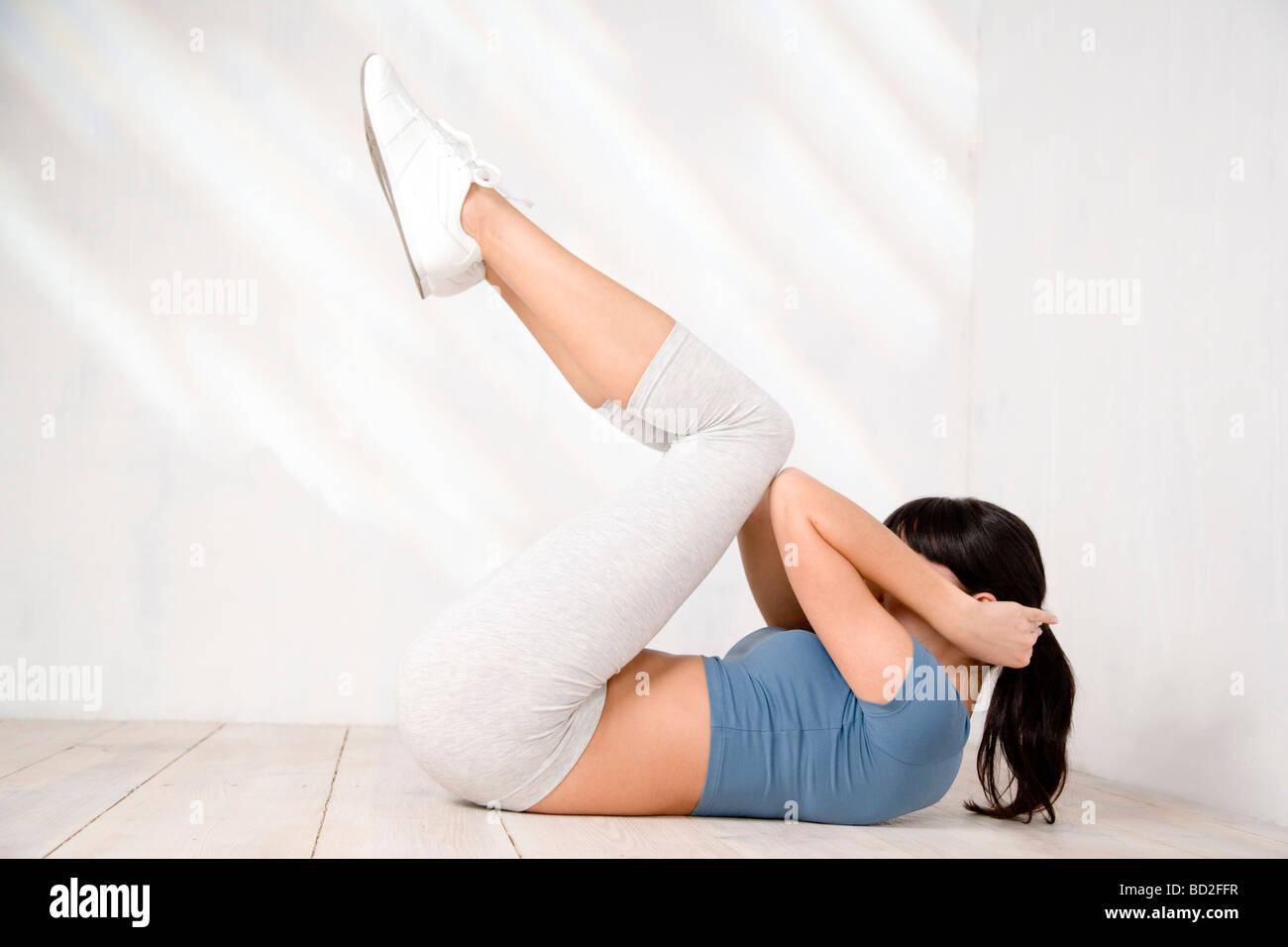 young woman doing exercises Stock Photo - Alamy