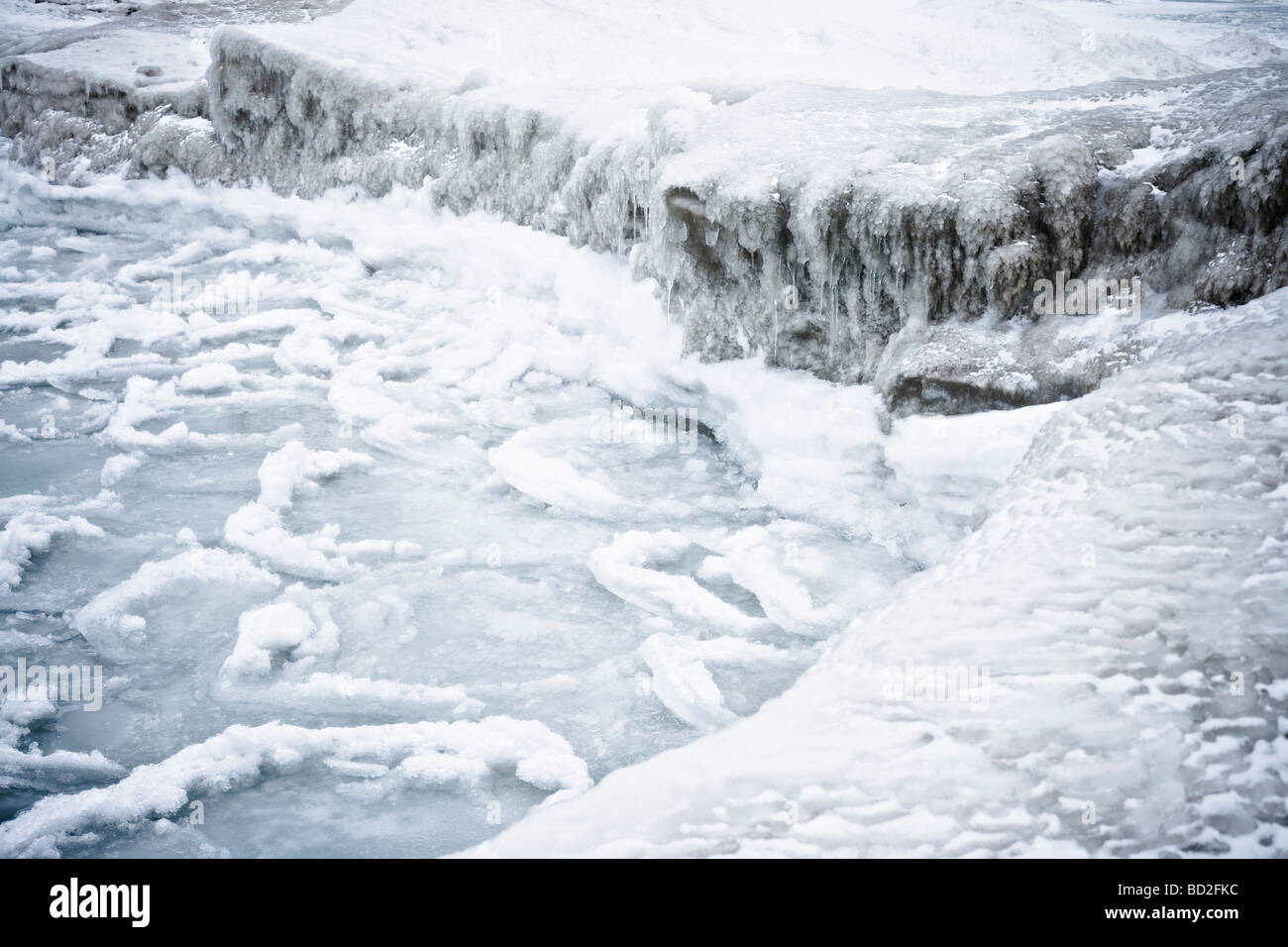 Edge of frozen lake Stock Photo - Alamy
