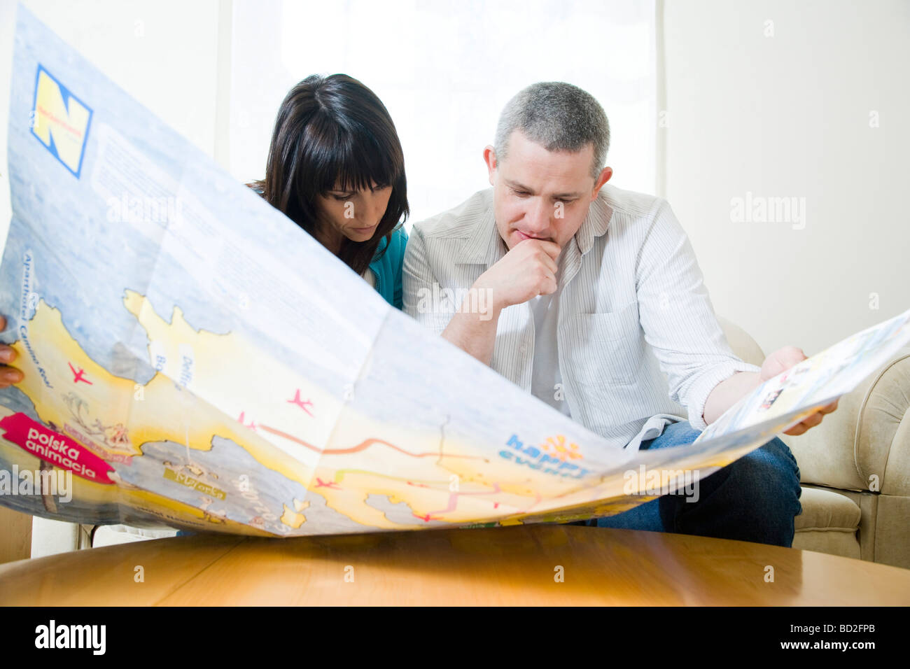 mature couple watching map Stock Photo - Alamy
