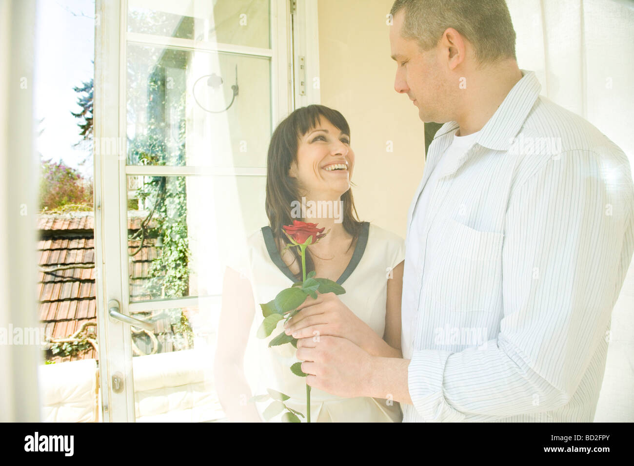 man giving rose to a woman Stock Photo - Alamy