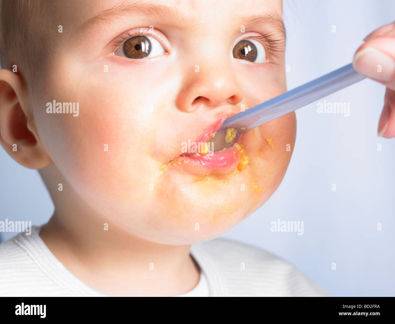 Portrait of a baby boy, eating Stock Photo - Alamy