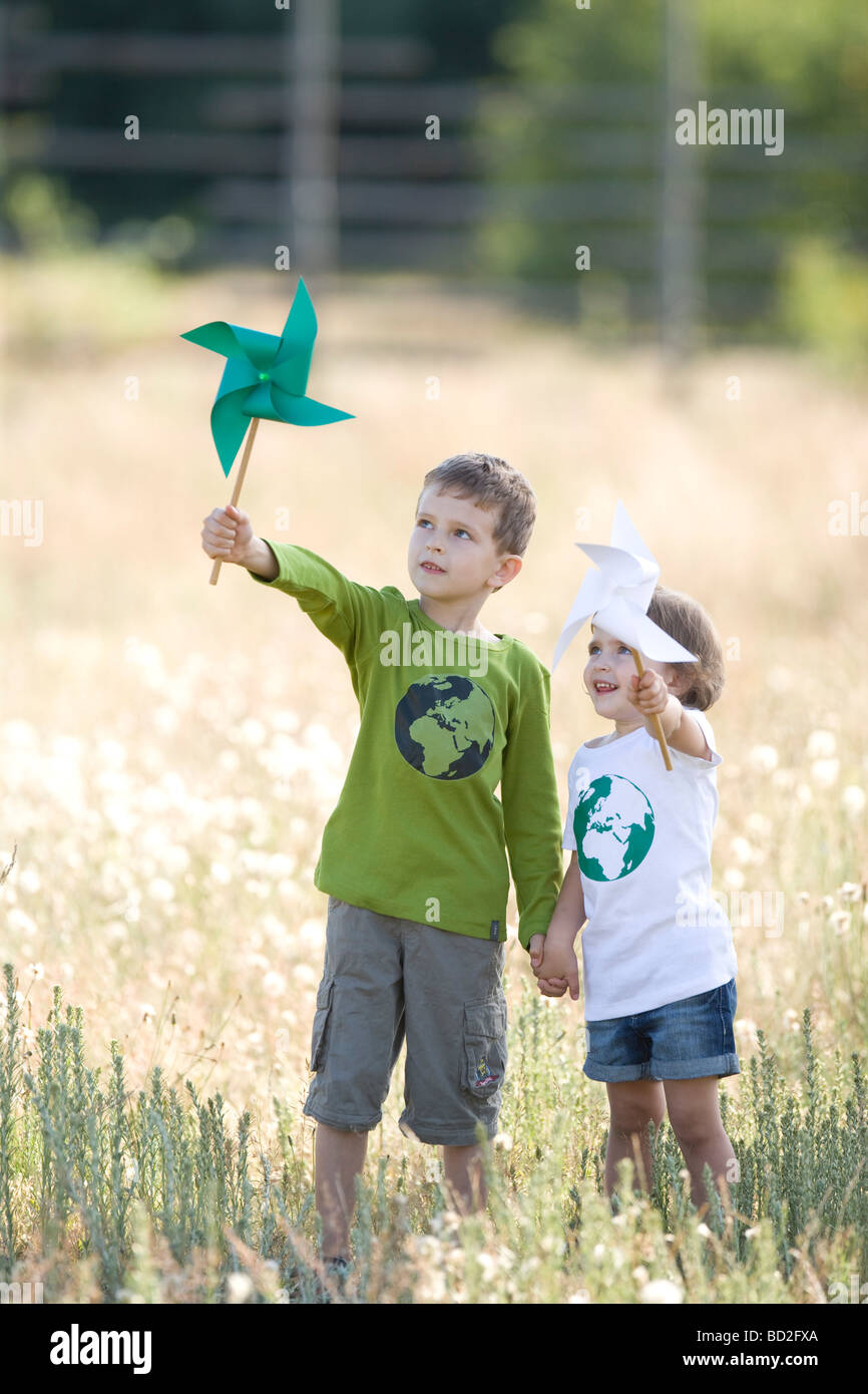 Children walking on meadow Stock Photo - Alamy