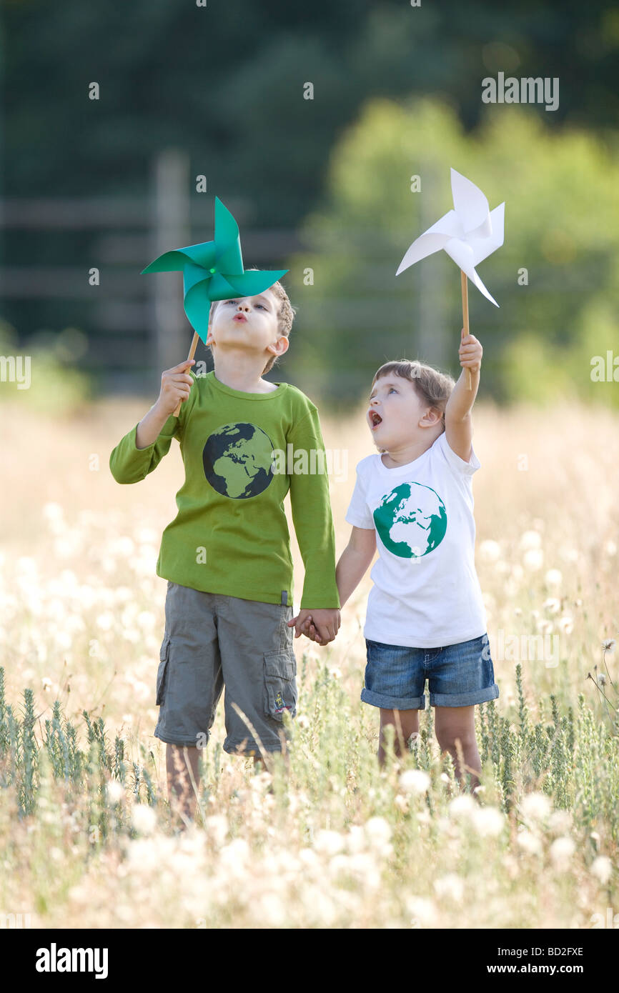 Children walking on meadow Stock Photo - Alamy