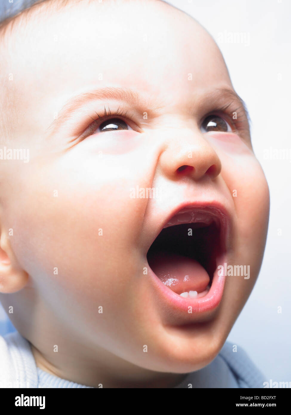 Portrait of a baby, laughing Stock Photo - Alamy