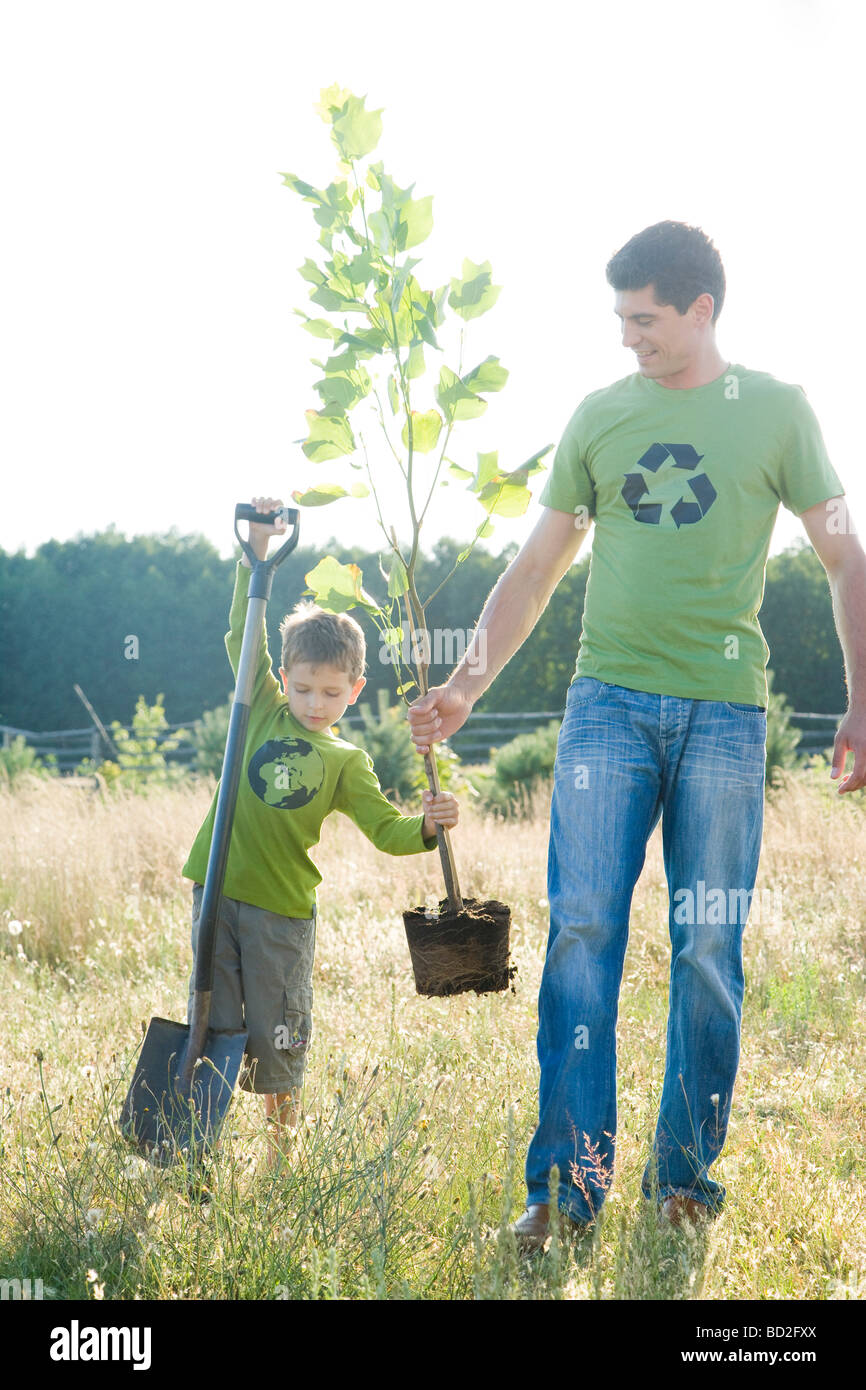 Father and son planting tree Stock Photo - Alamy