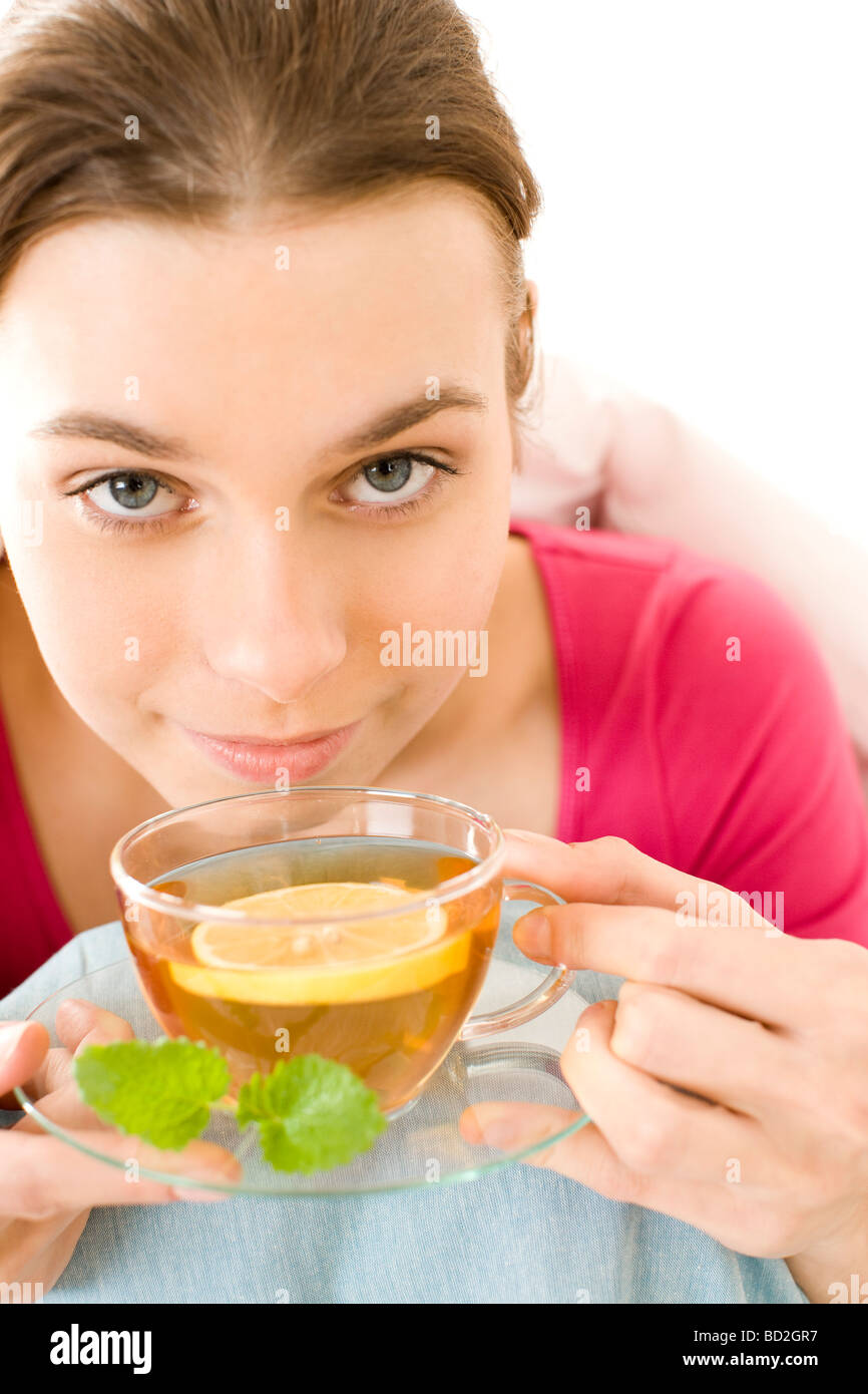 Sick woman drinking tea with lemon Stock Photo - Alamy