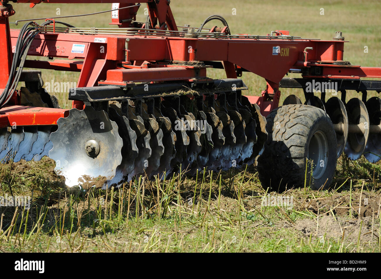 Tractor plowing field Stock Photo - Alamy