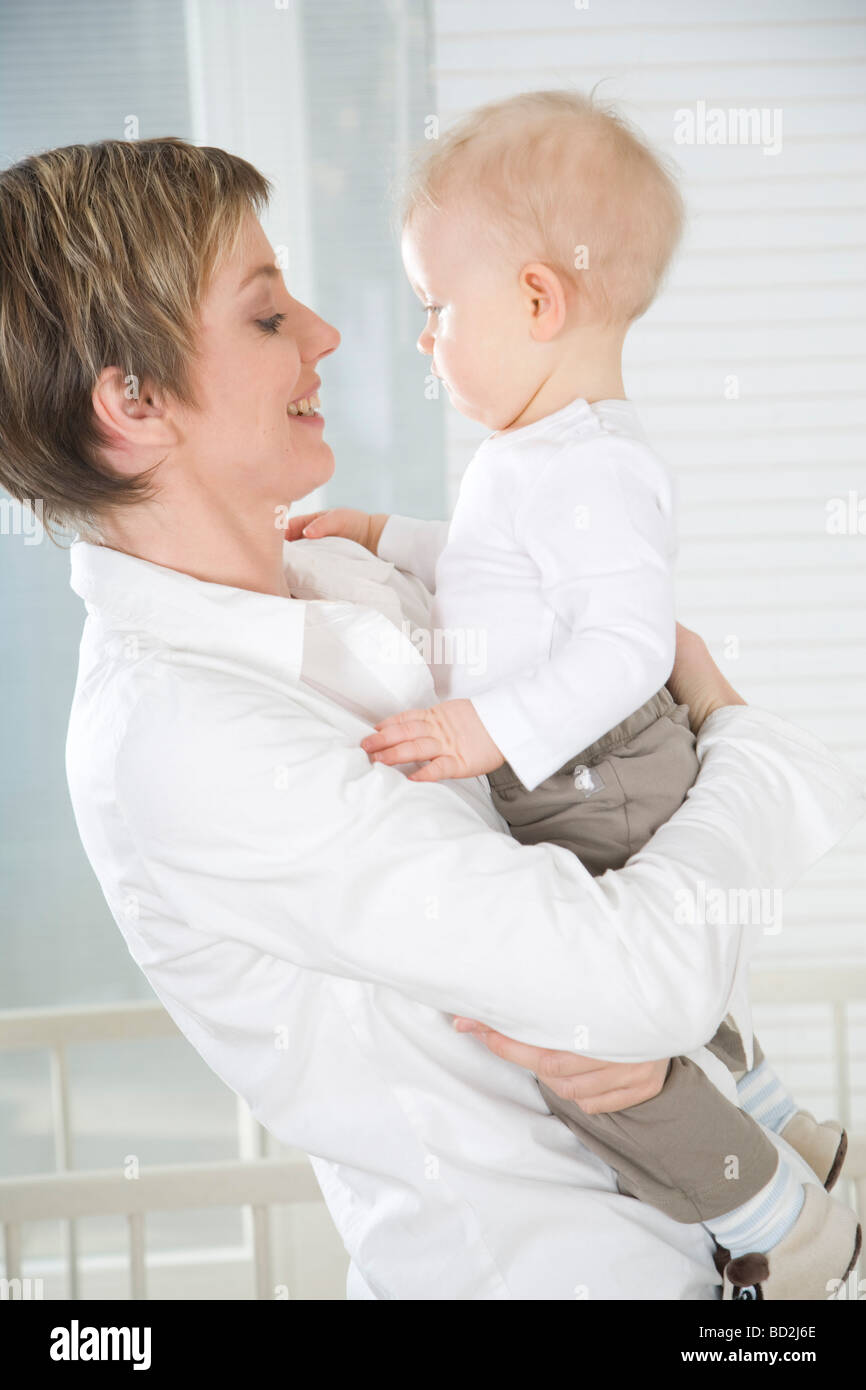 Months carrying hug hugging infant hi-res stock photography and images ...