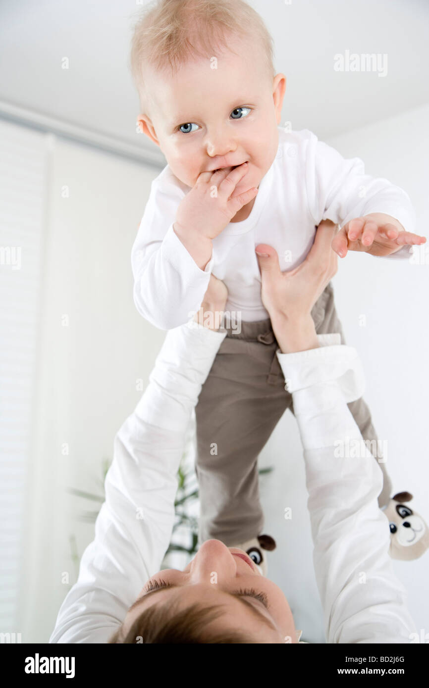 Months carrying hug hugging infant hi-res stock photography and images ...