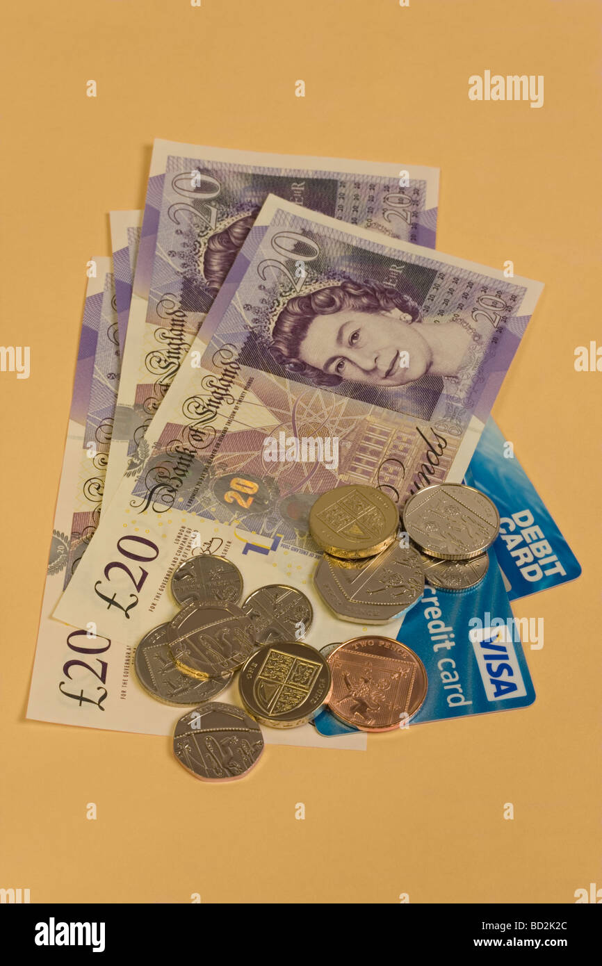 Twenty pound notes with coins and Visa cards Stock Photo - Alamy