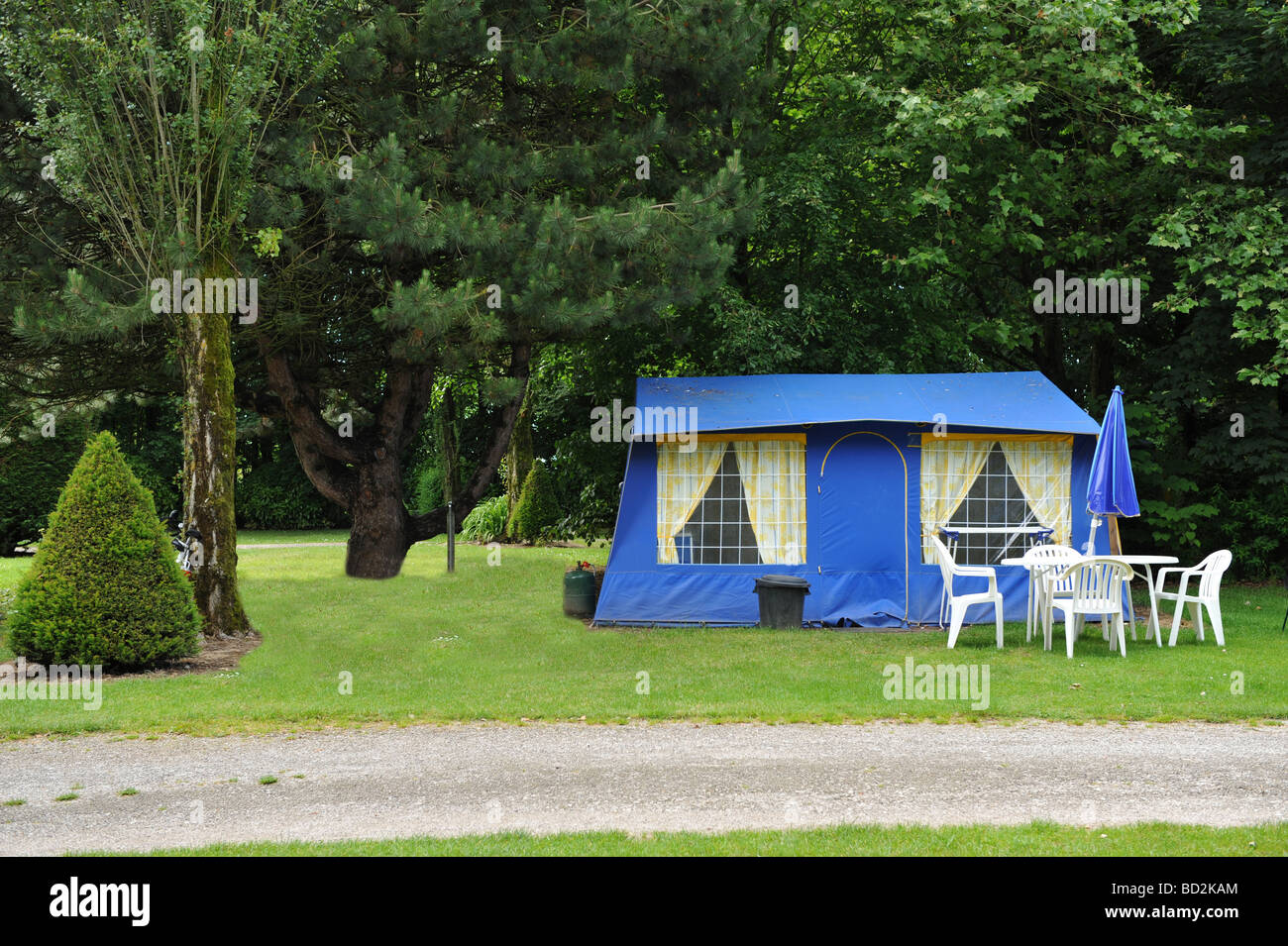 Family frame tent erected on a well tended and peaceful woodland ...